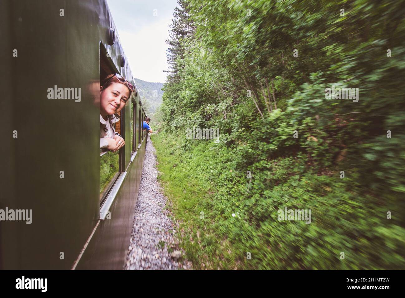 Travel with old-fashioned train, Tourist Attraction, woman looking out ...