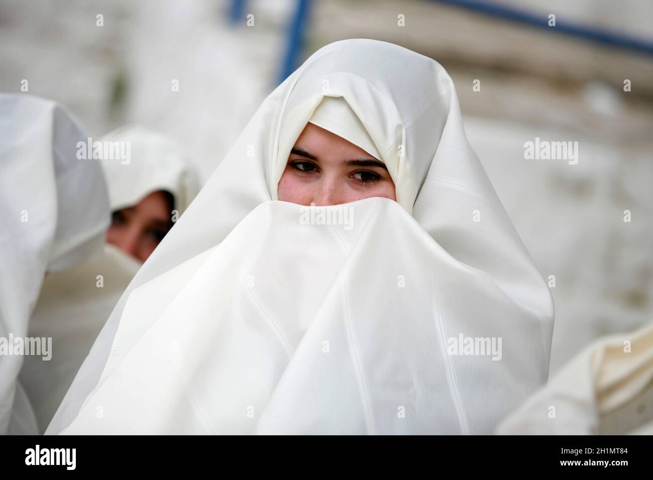 Tunisian Muslim Women in traditional Tunisia clothes in the Old Town of ...