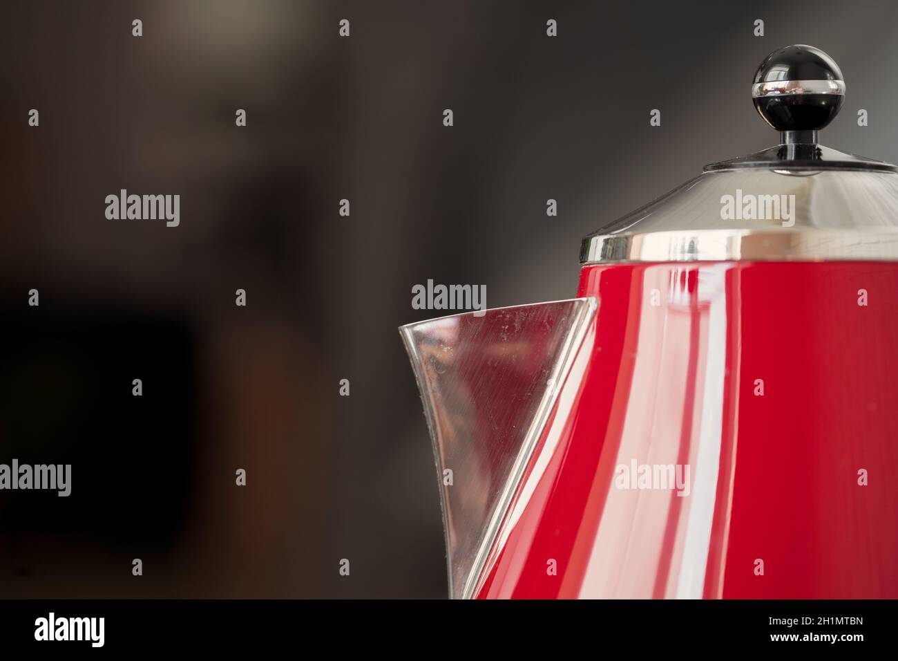 Vintage style red electrical teapot in kitchen interior Stock Photo - Alamy