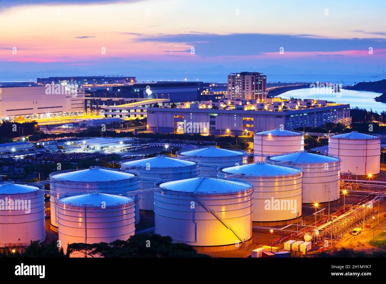 Oil tank during sunset Stock Photo - Alamy