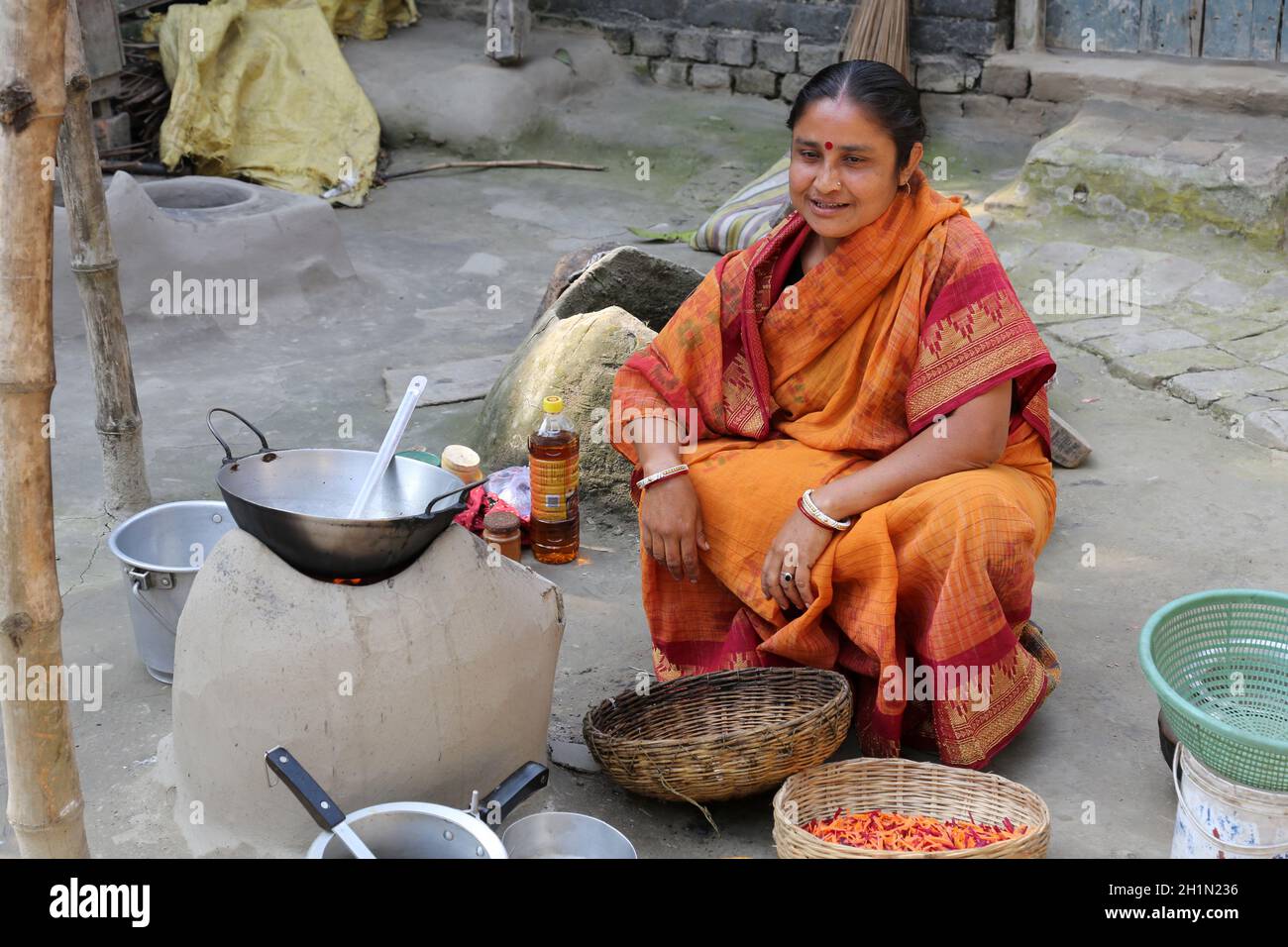 Traditional way of making food on open fire in old kitchen in a village ...