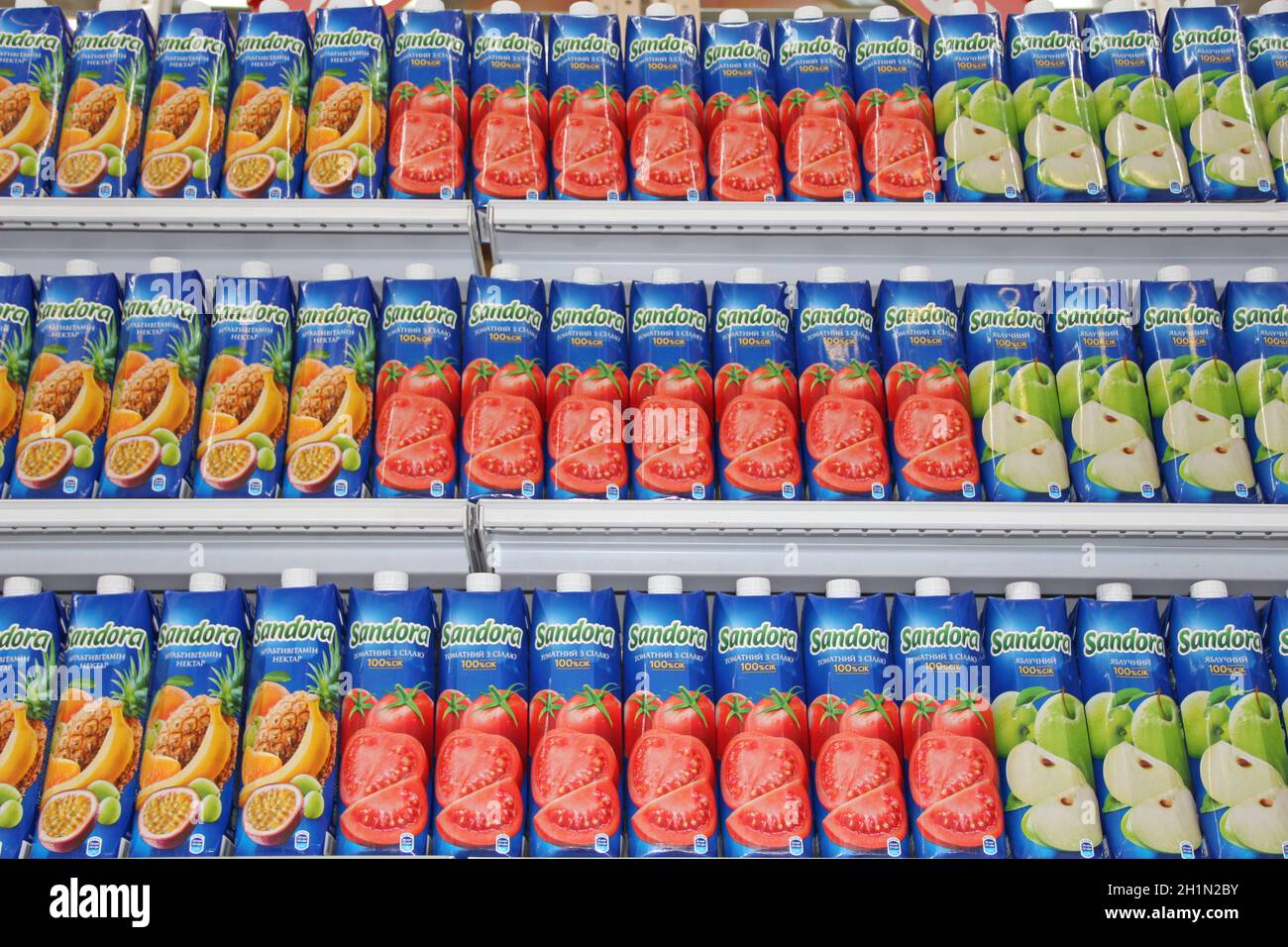 Wide range of juices on supermarket shelves. Natural juices on shelves ...