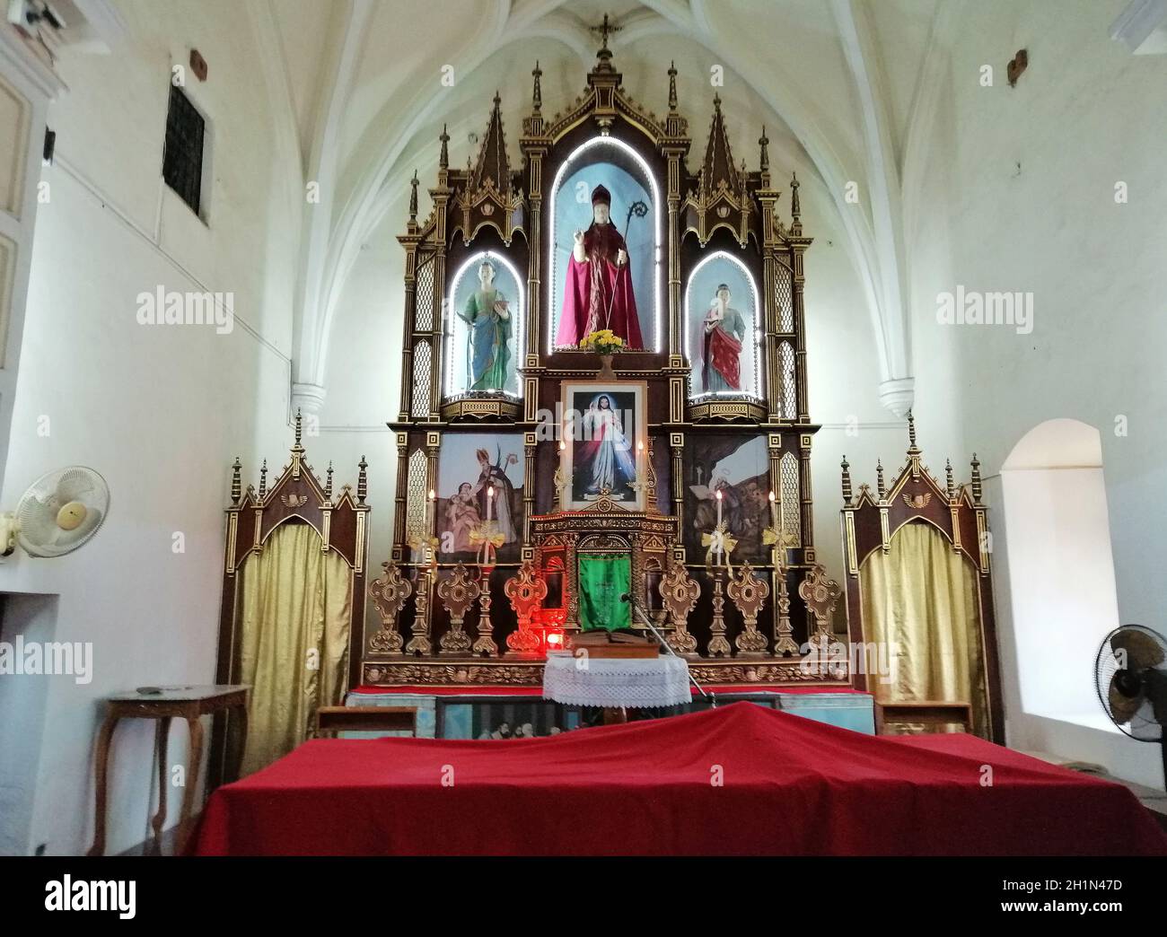 Main altar at St. Blaise Catholic Church in Gandaulim, Goa, India Stock ...