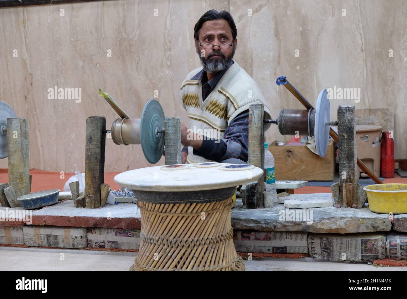 Craftsman works in a workshop making inlaid marble in Agra, Uttar ...
