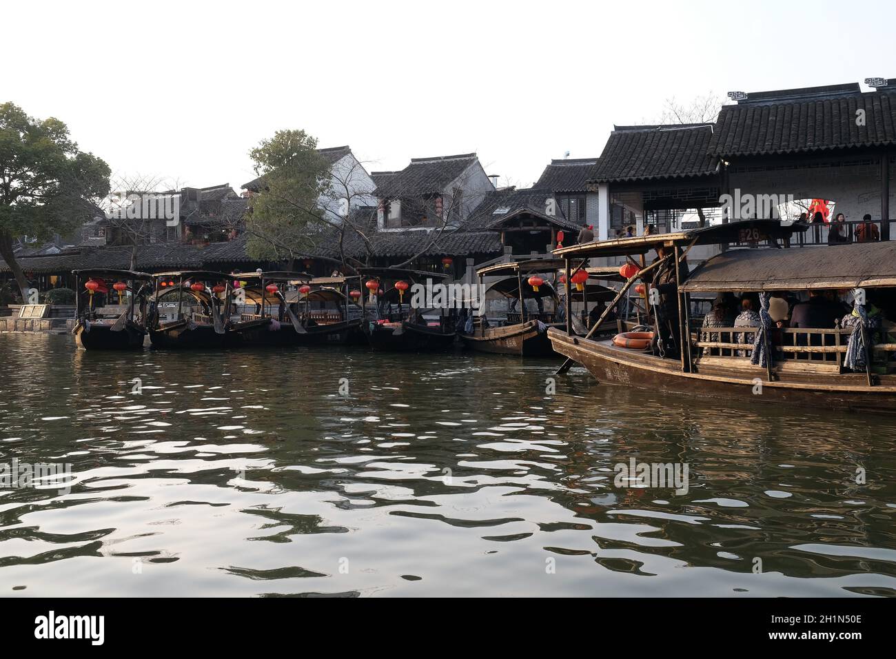 Tourist boats on the water canals of Xitang Town in Zhejiang Province ...