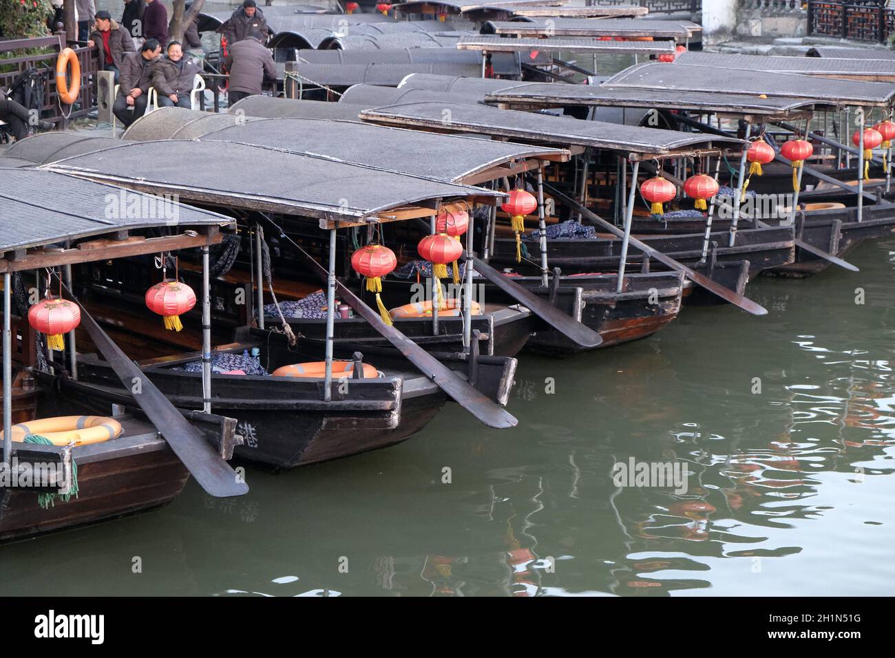 Tourist boats on the water canals of Xitang Town in Zhejiang Province ...