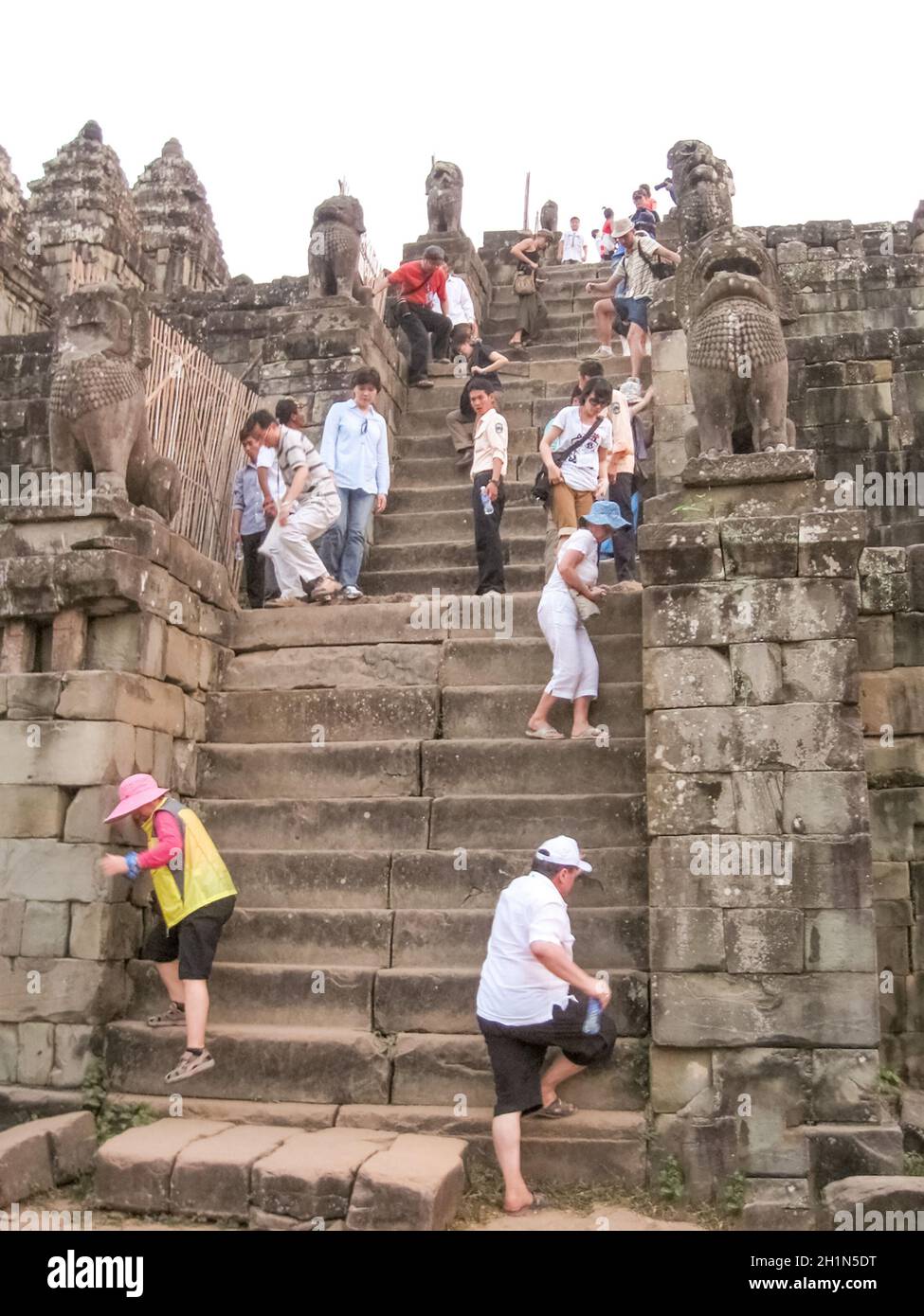 Descending the temple steps of the rock temple hi-res stock photography ...