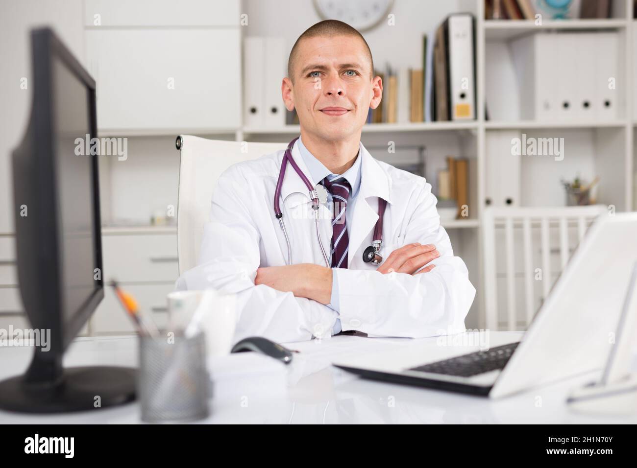 Confident doctor using desktop hi-res stock photography and images - Alamy