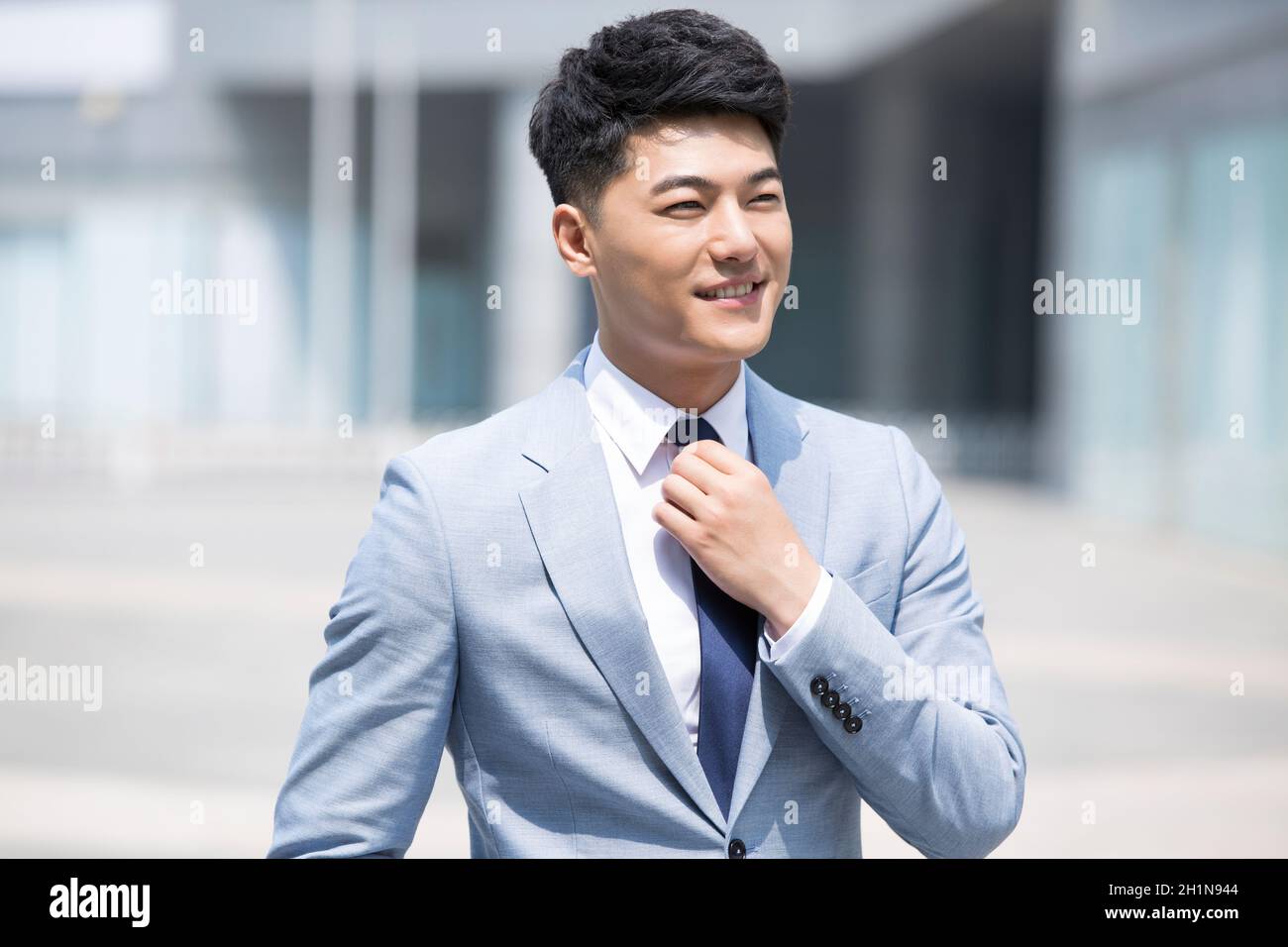 Cheerful young chinese businessman hi-res stock photography and images ...