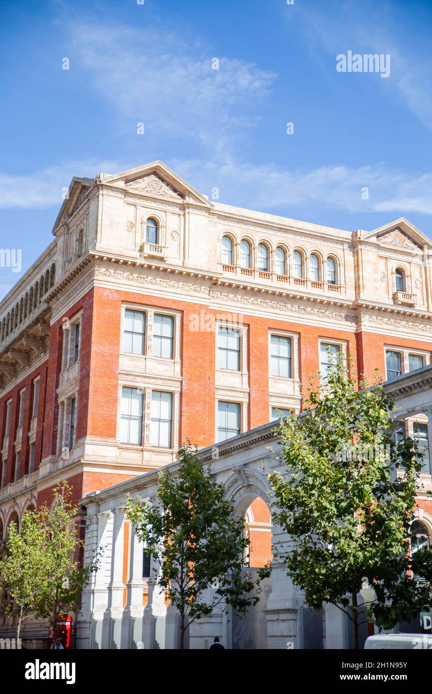 Victoria and Albert Museum and its arched entrance under blue sky ...