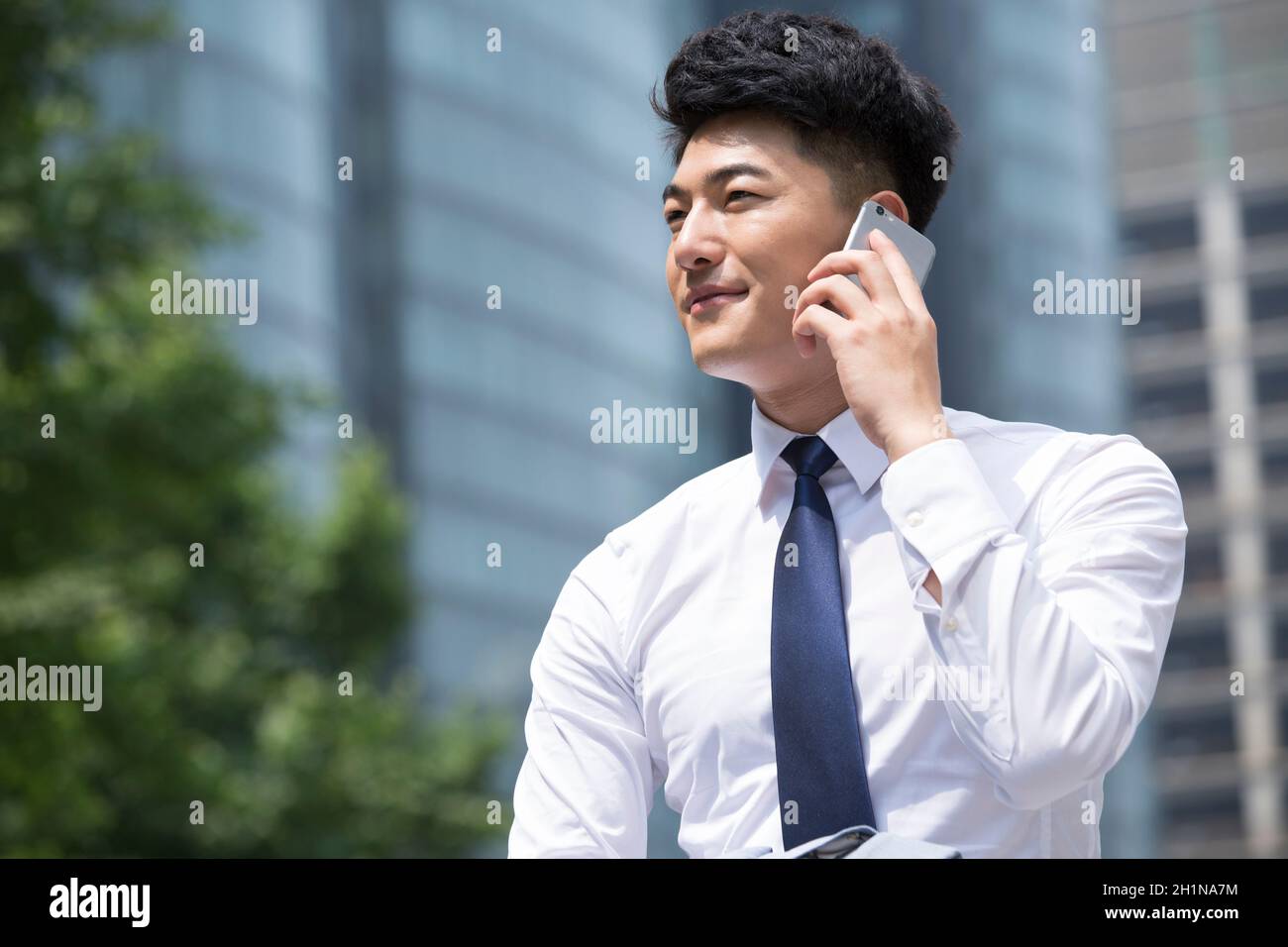 Cheerful chinese businessman talking hi-res stock photography and ...
