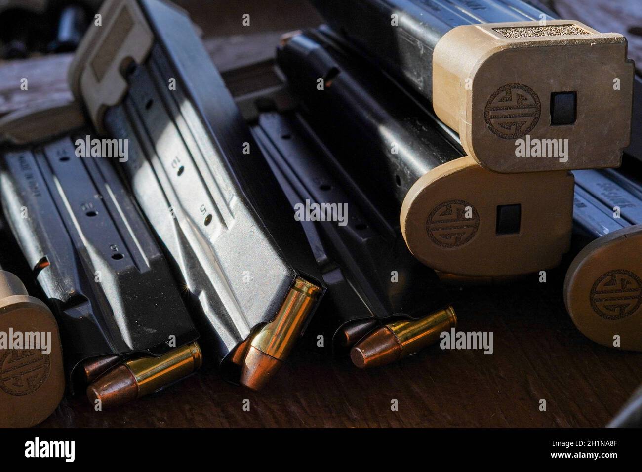 Loaded 9mm magazines are stacked on a table before paratroopers ...