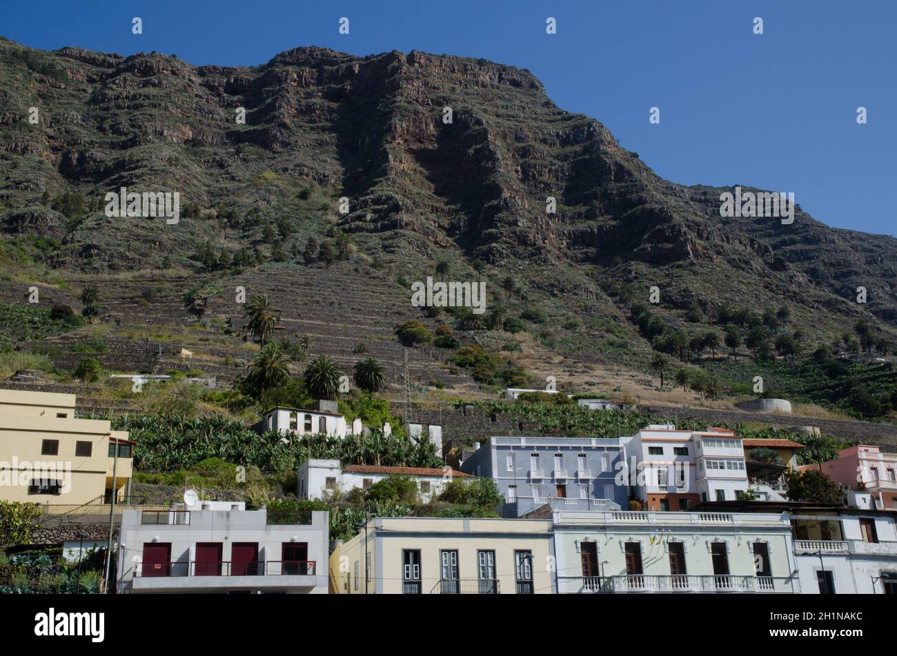Cliff and houses in the valley of Hermigua. La Gomera. Canary Islands. Spain Stock Photo - Alamy