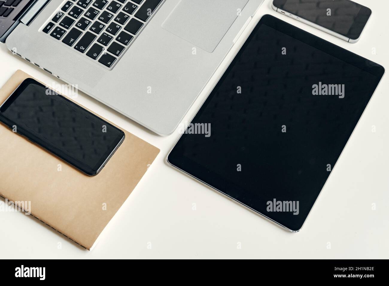 Close up shot of digital devices on office table Stock Photo - Alamy