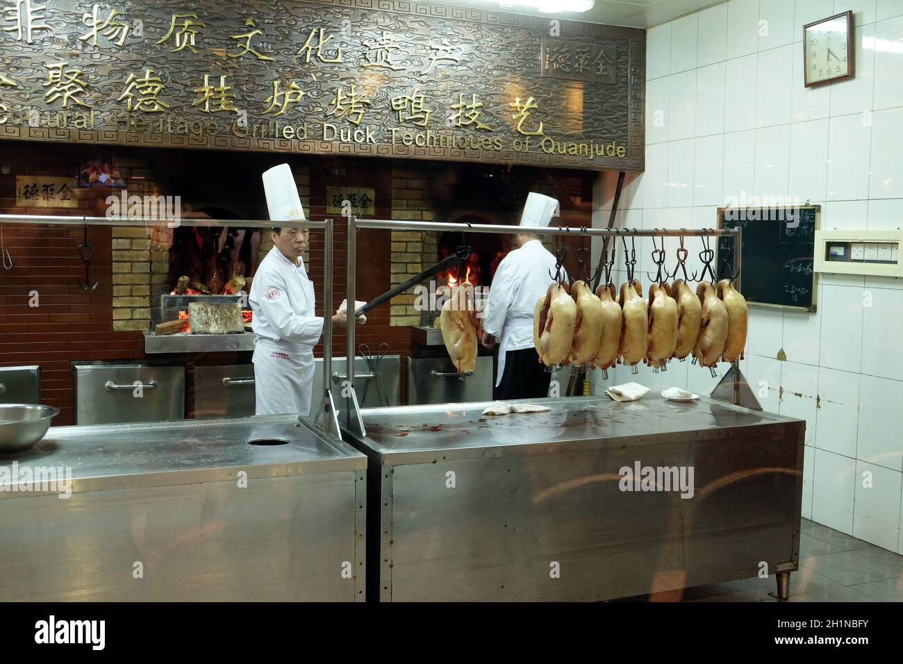 Chefs prepare duck roasting in the original Quanjude restaurant at the ...