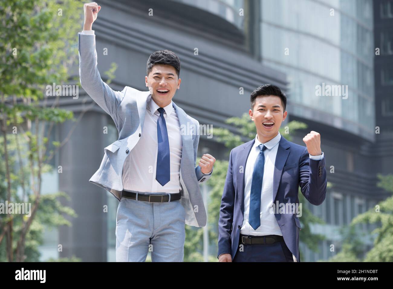 Three businessmen cheering hi-res stock photography and images - Alamy