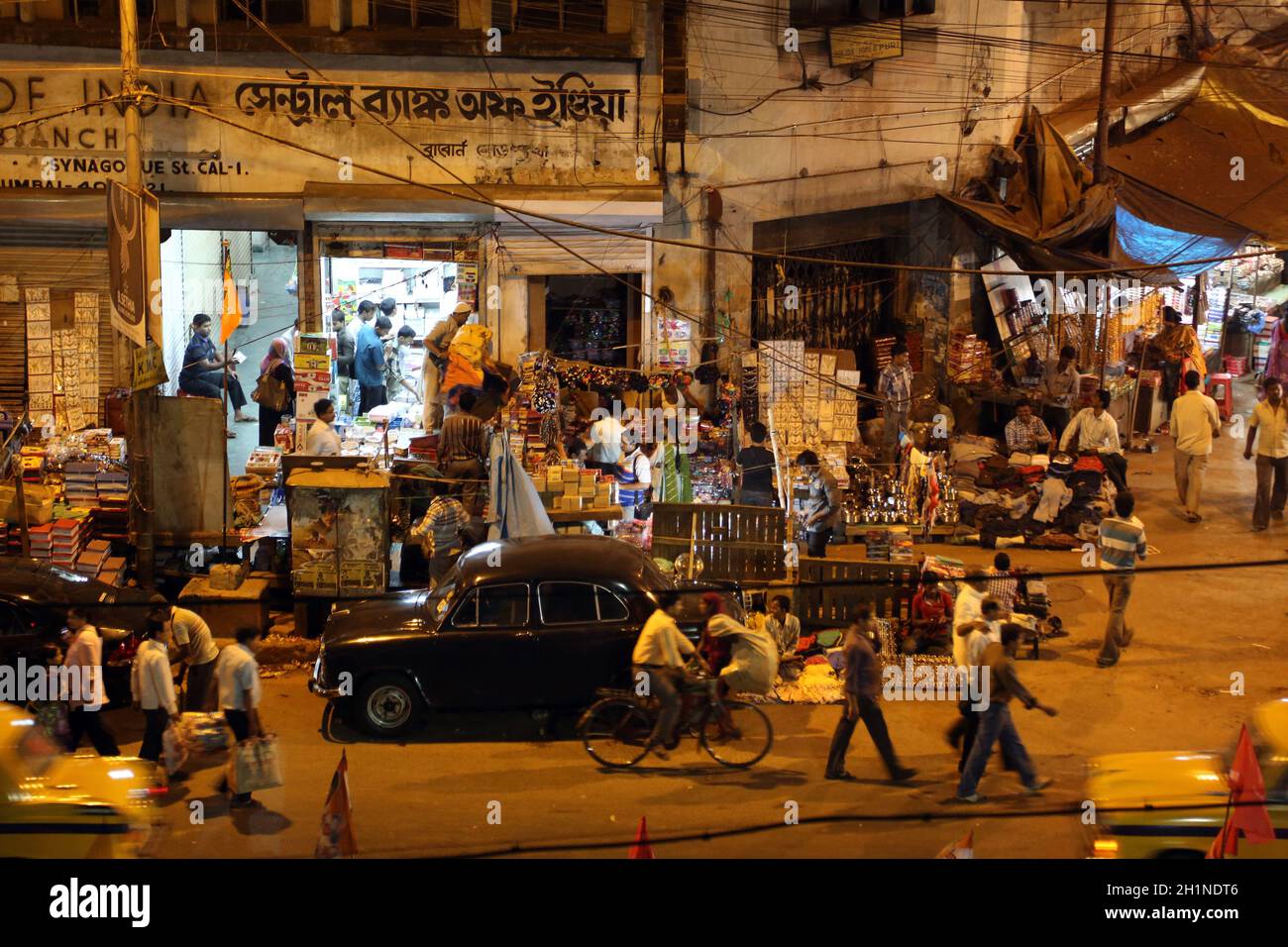 Dark city traffic blurred in motion at late evening on crowded streets ...