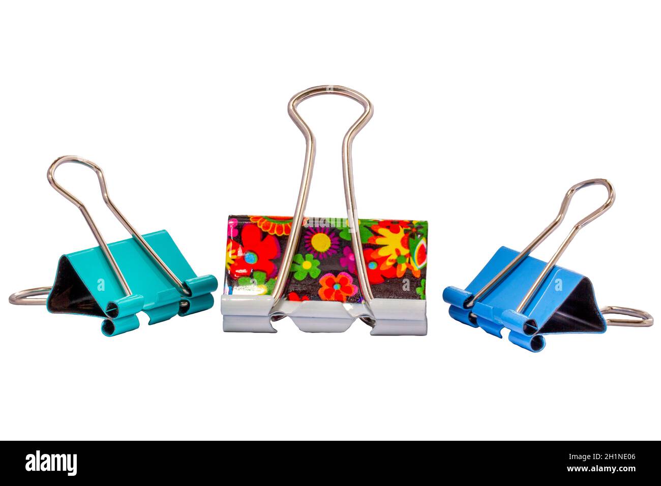 Three plain blue paper clips and metal floral motifs, isolated with a ...