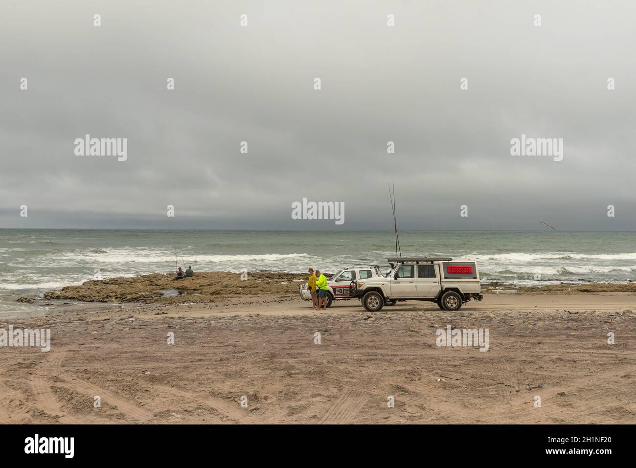 Surf fishing on the Skeleton Coast in the north of Swakopmund, Namibia ...