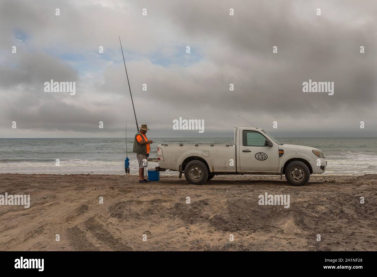 Surf fishing on the Skeleton Coast in the north of Swakopmund, Namibia ...