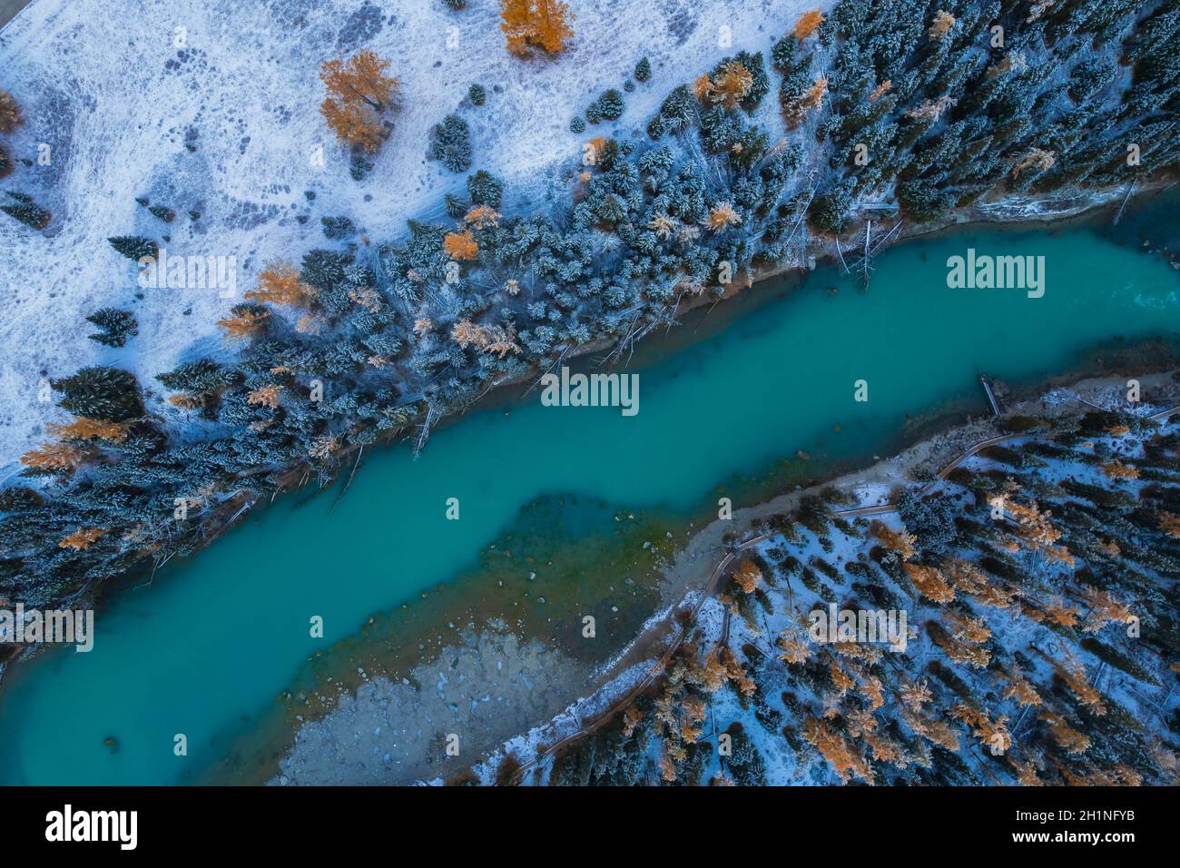 Aerial view of the winter landscape of lake and forest in Kanas, at ...