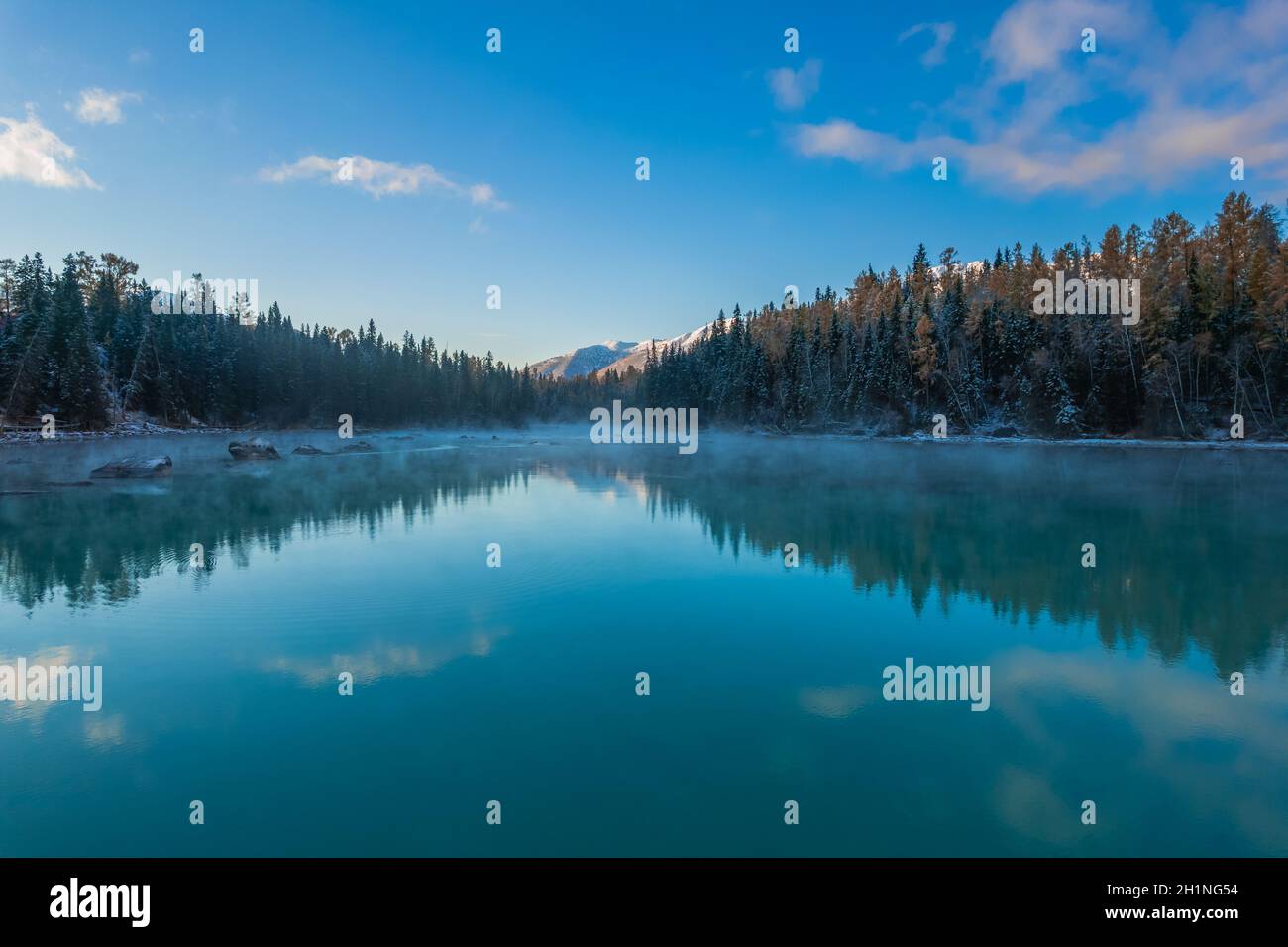 Aerial view of the winter landscape of lake and forest in Kanas, at ...