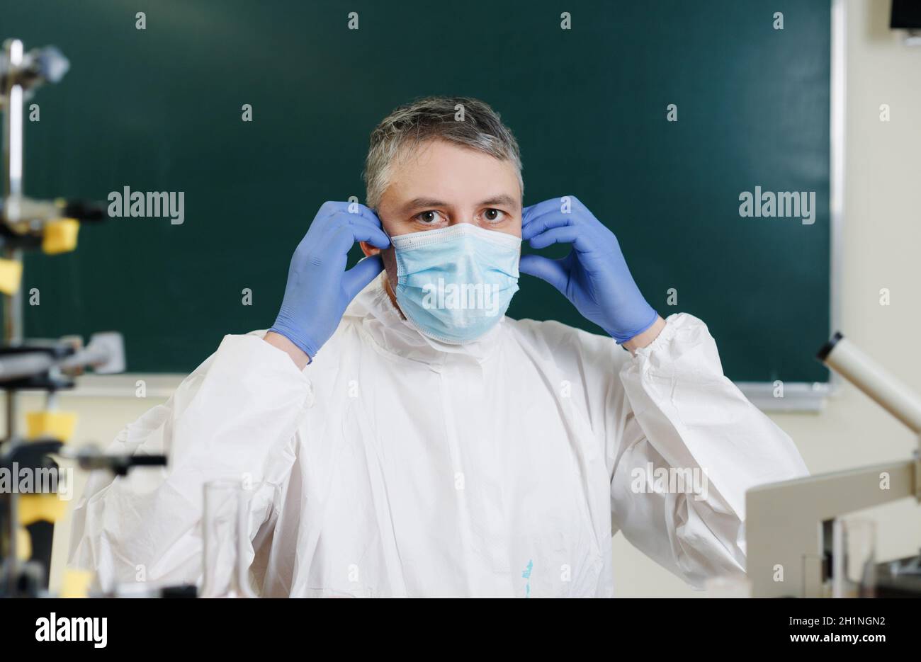 Scientist in biological protection mask hi-res stock photography and ...