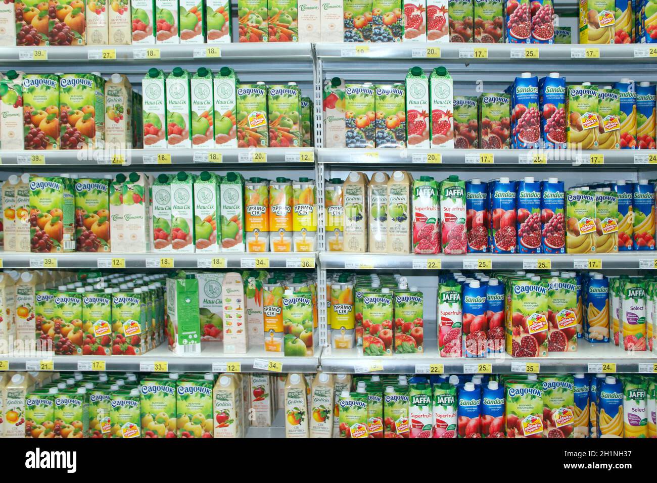 juices on supermarket shelves. Natural juices on shelves of shop ...