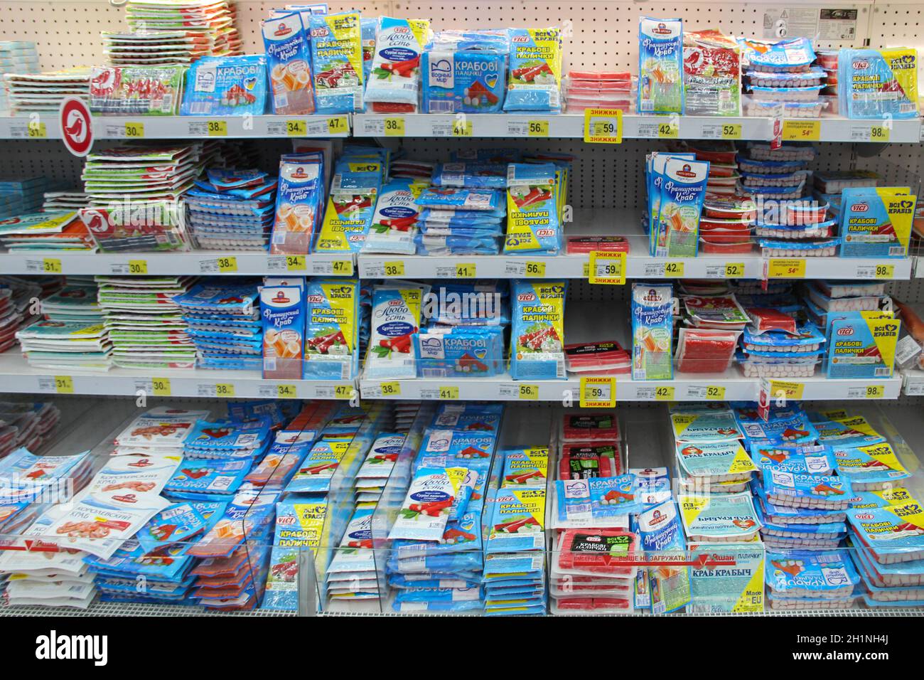 Crab sticks on shelves in supermarket. Various crab stick in sale ...