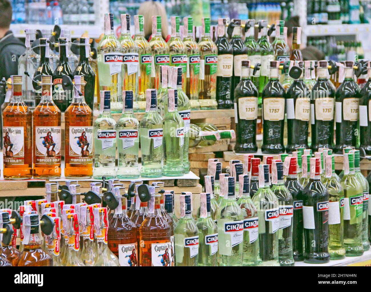 Wide assortment of alcoholic drinks on shelves of supermarket. Wide ...