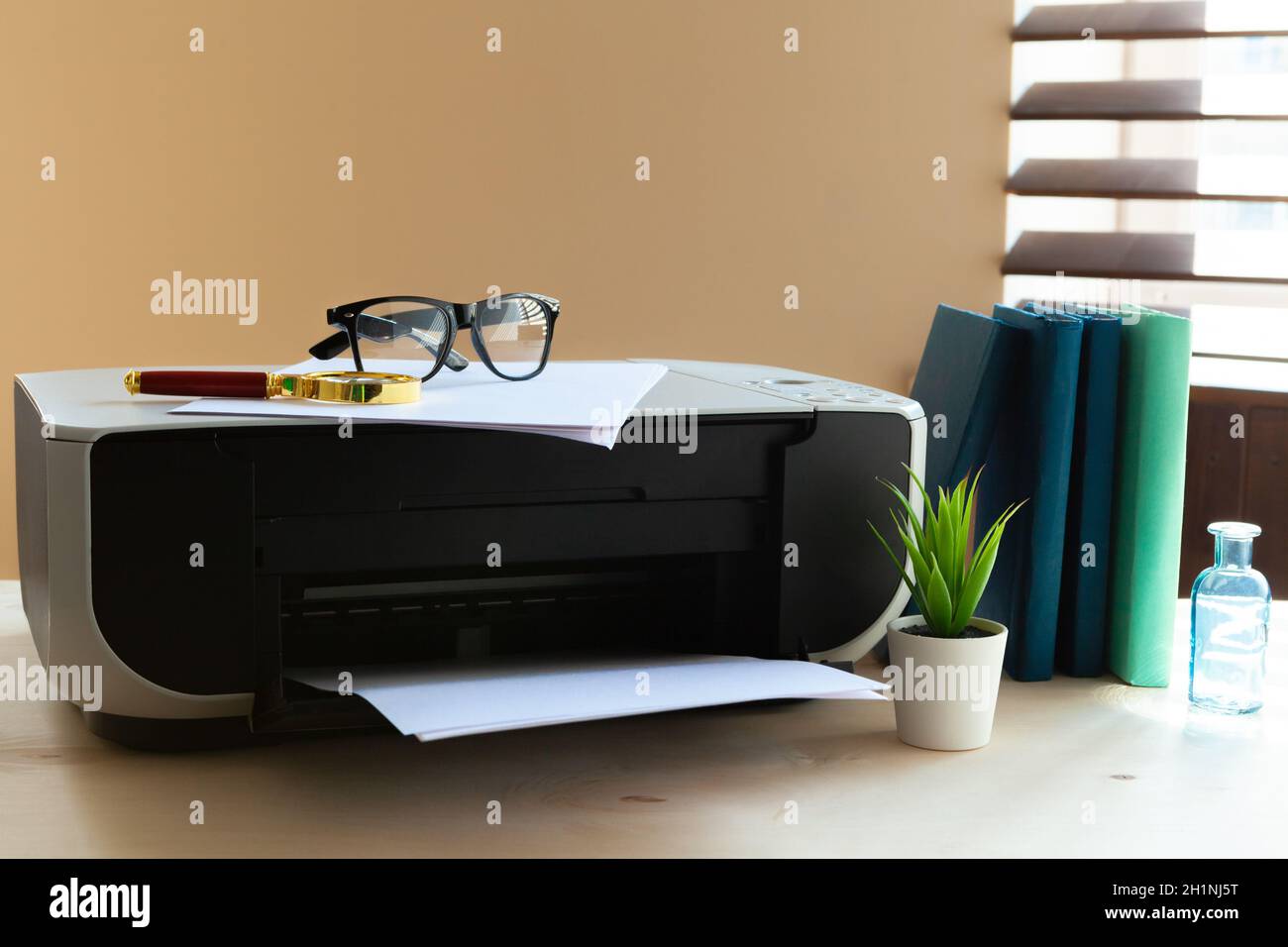 Close up of an office table with printer on it Stock Photo - Alamy