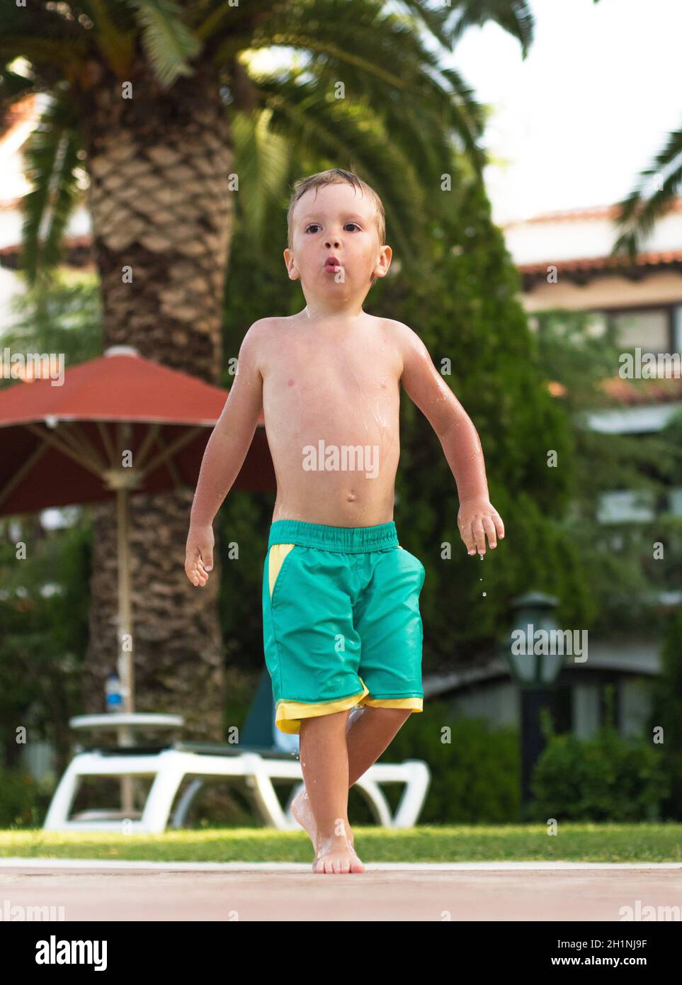 In swimming trunks hi-res stock photography and images - Alamy