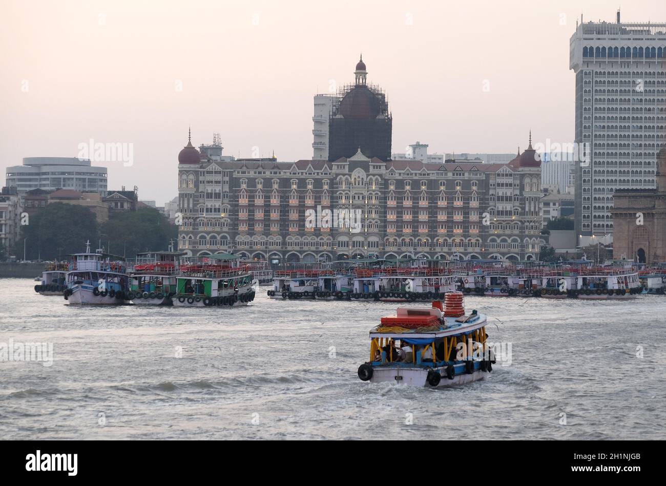 Taj Mahal hotel and tourist boats in water of Arabian Sea in Mumbai, India Stock Photo - Alamy