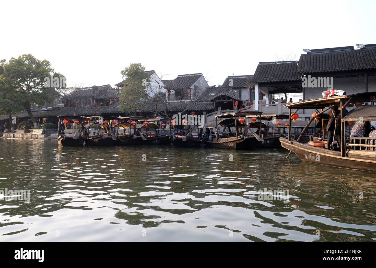Tourist boats on the water canals of Xitang Town in Zhejiang Province ...