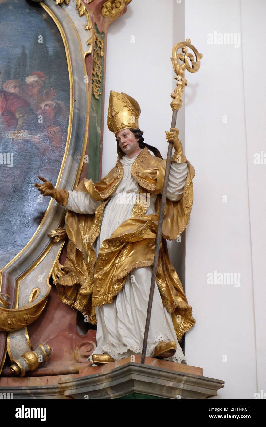 Statue of Saint, Altar in Collegiate church in Salzburg Stock Photo - Alamy