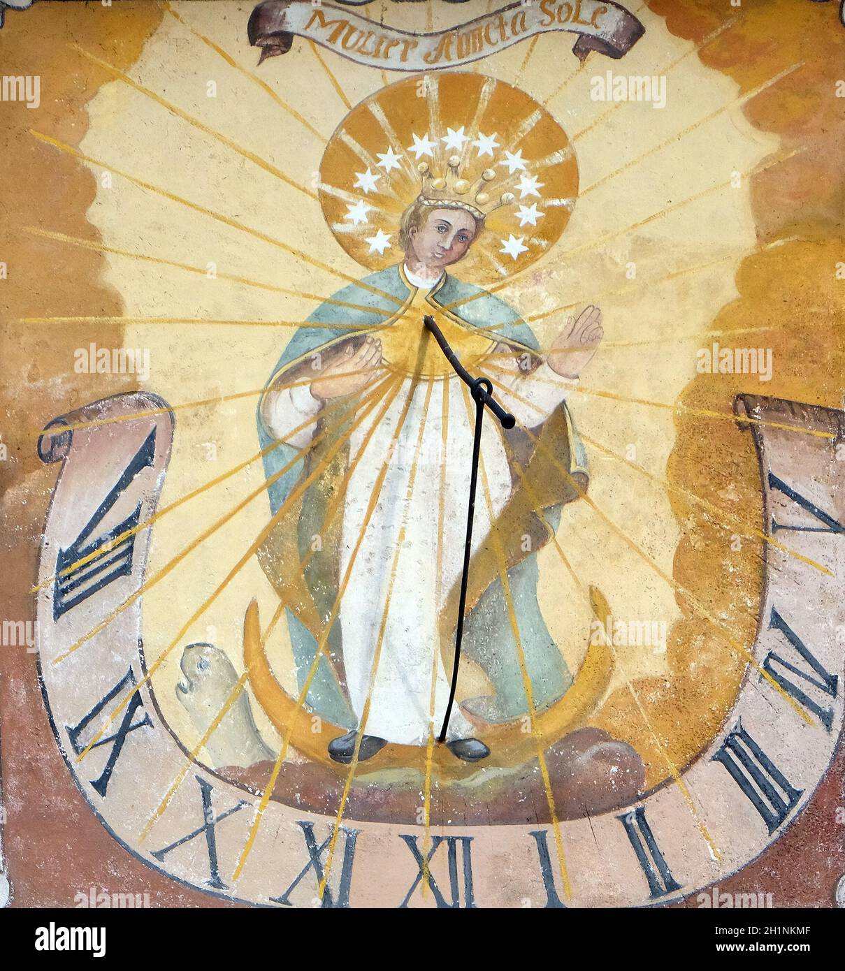 Virgin Mary, sundial, painting on house facade in Hallstatt, Austria ...
