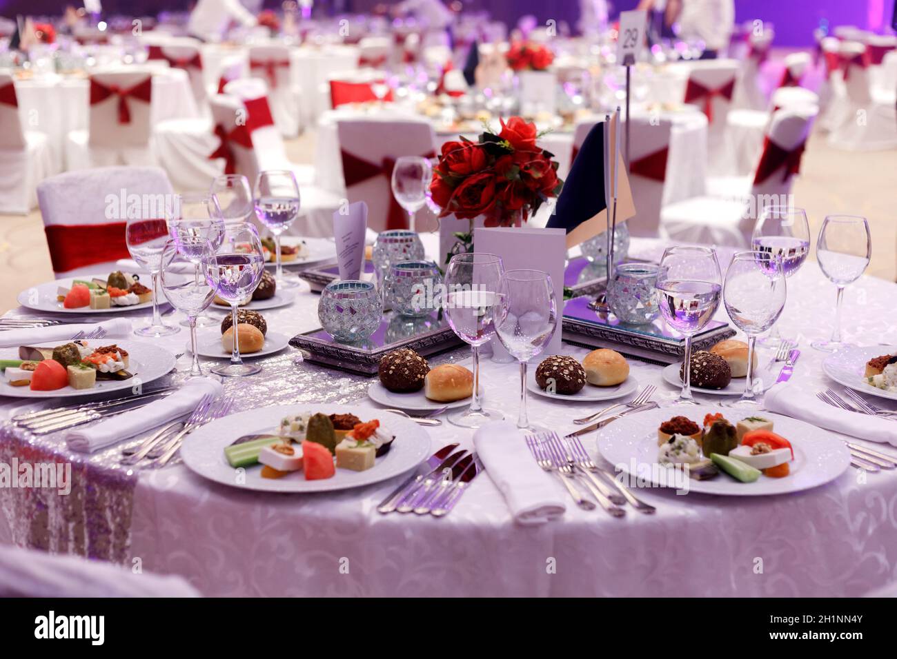 Festive round table setting in a prestigious restaurant for dinner ...