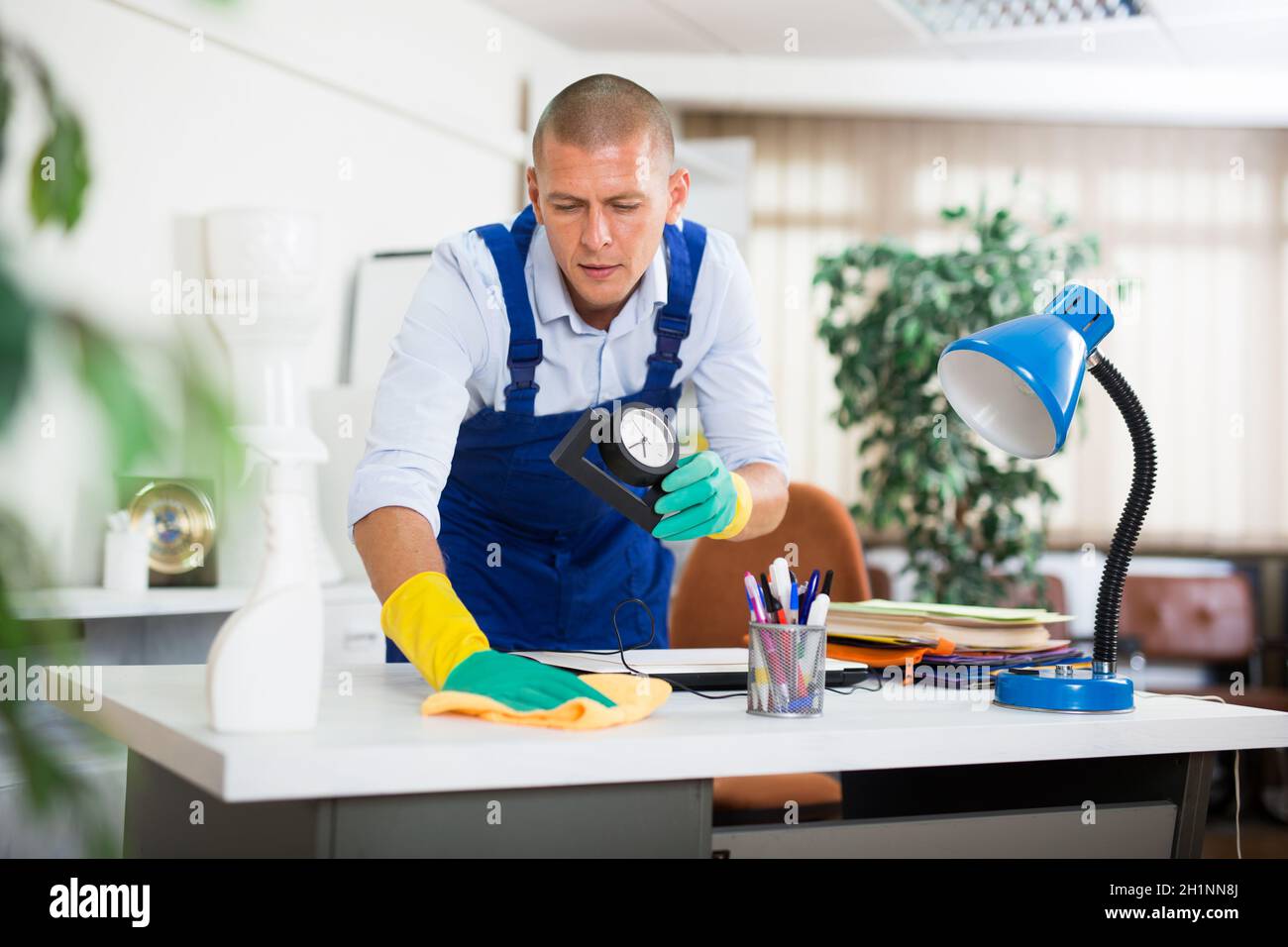Positive professional spanish cleaner cleaning hi-res stock photography ...