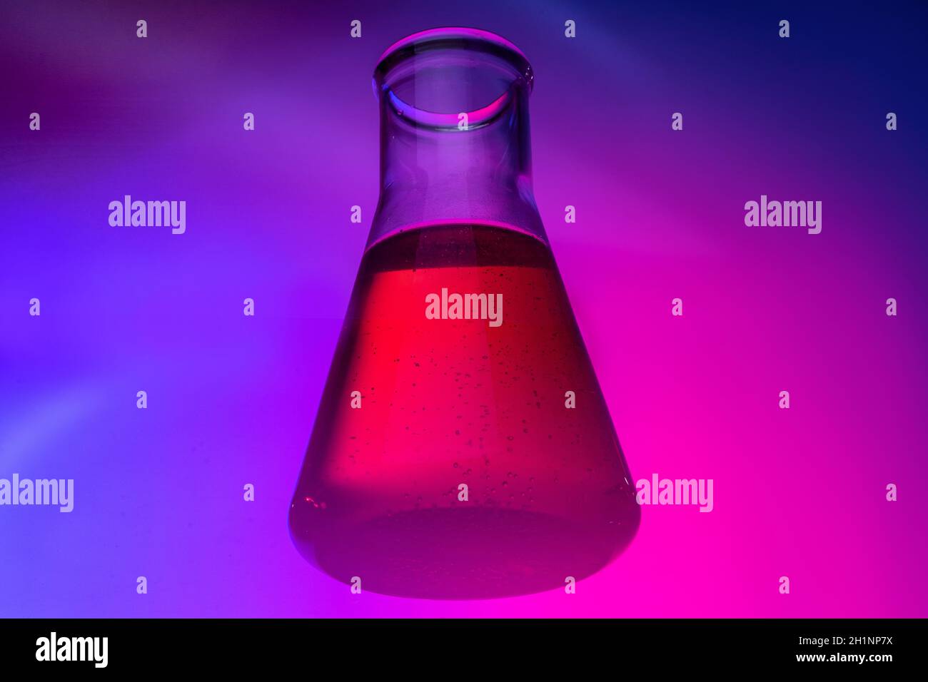 Laboratory glass tubes with chemicals on bright pink background Stock ...