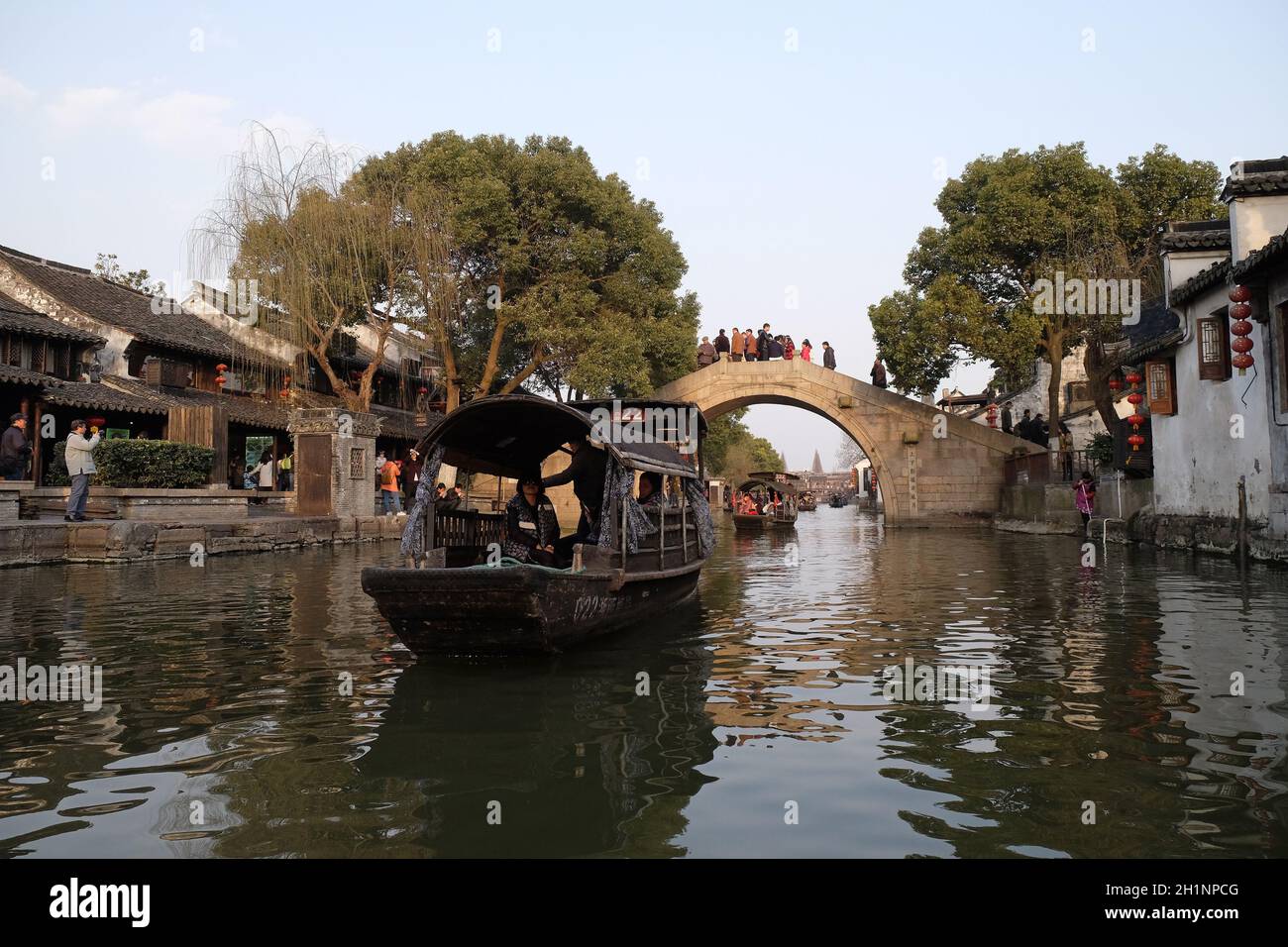 Tourist boats on the water canals of Xitang Town in Zhejiang Province ...