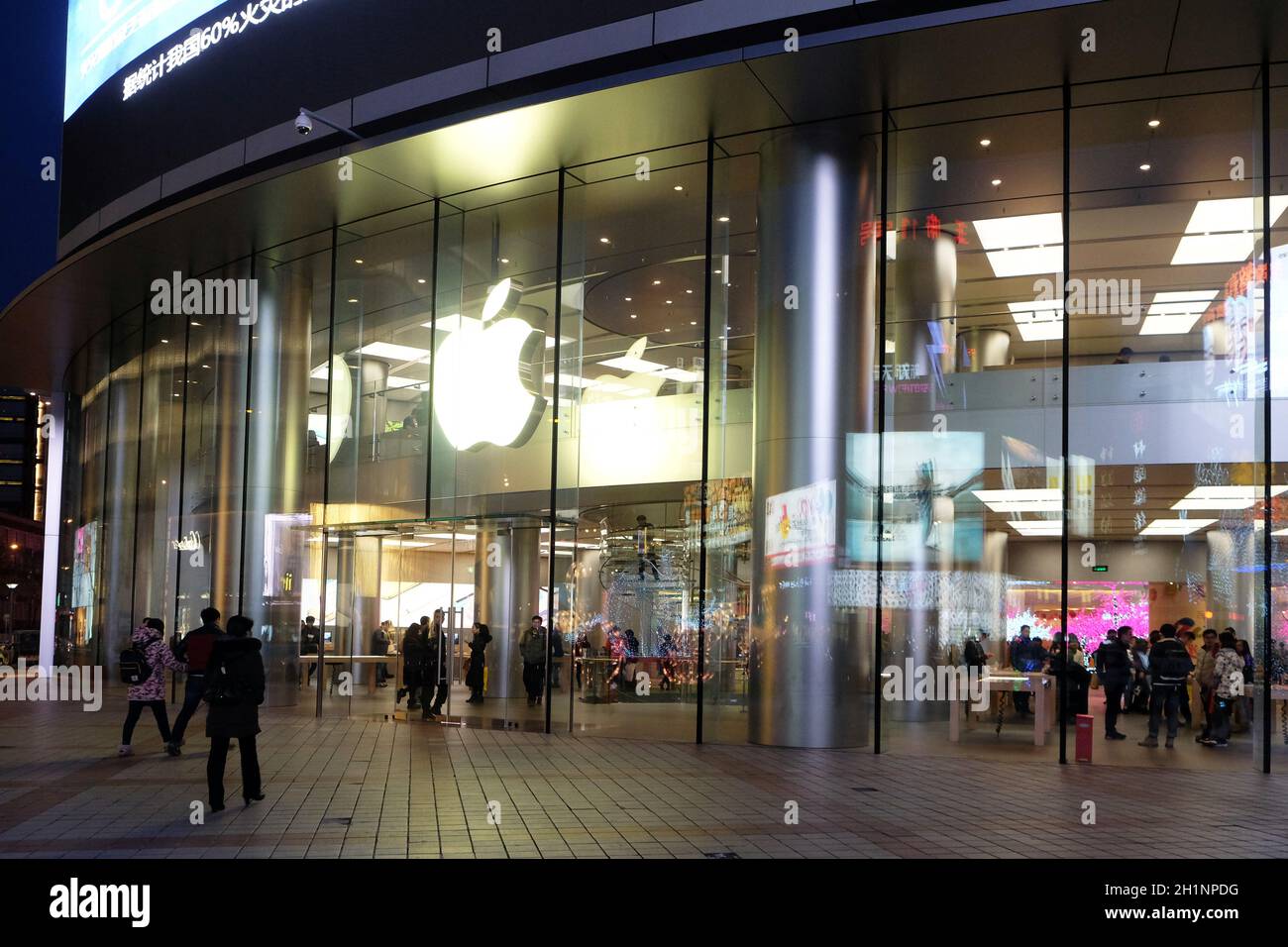 People walking in front of Apple store on Wangfujing street in Beijing ...