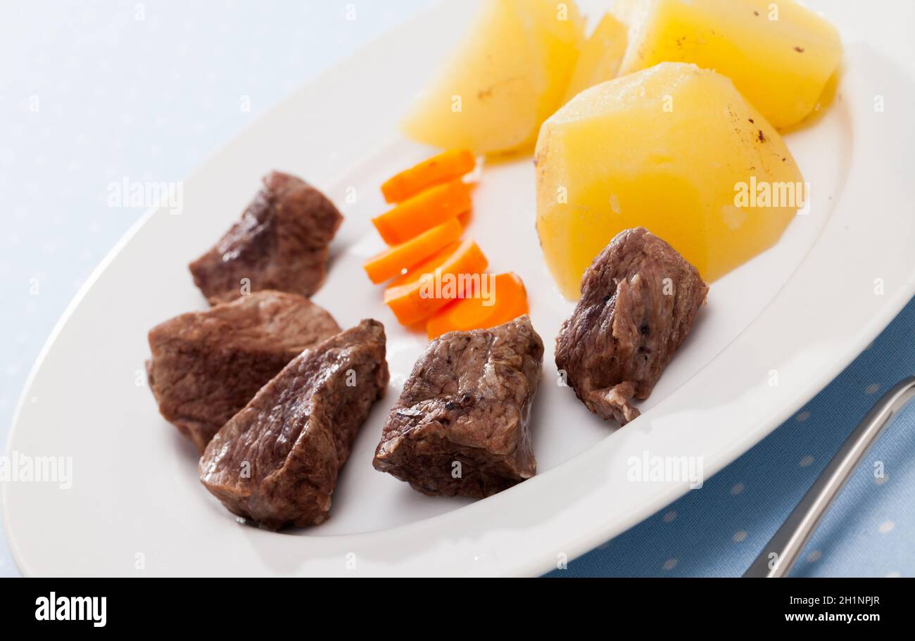 Steamed veal with potatoes and carrot Stock Photo - Alamy