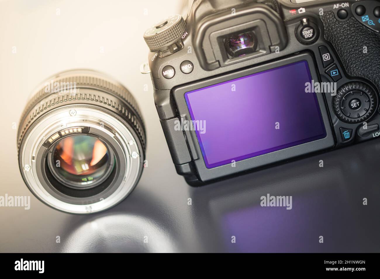 Back view of a professional reflex camera with flip lsd screen and a ...