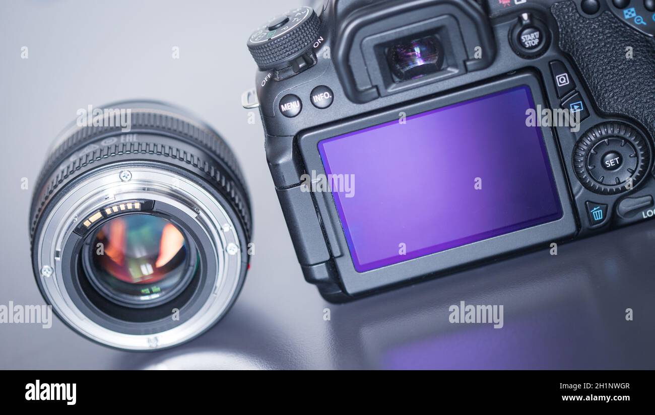 Back view of a professional reflex camera with flip lsd screen and a ...