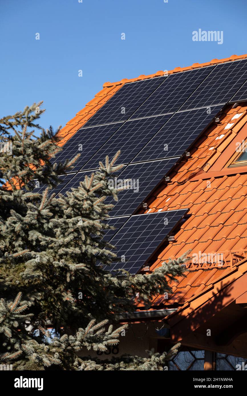 Solar electric panels on a house roof Stock Photo - Alamy