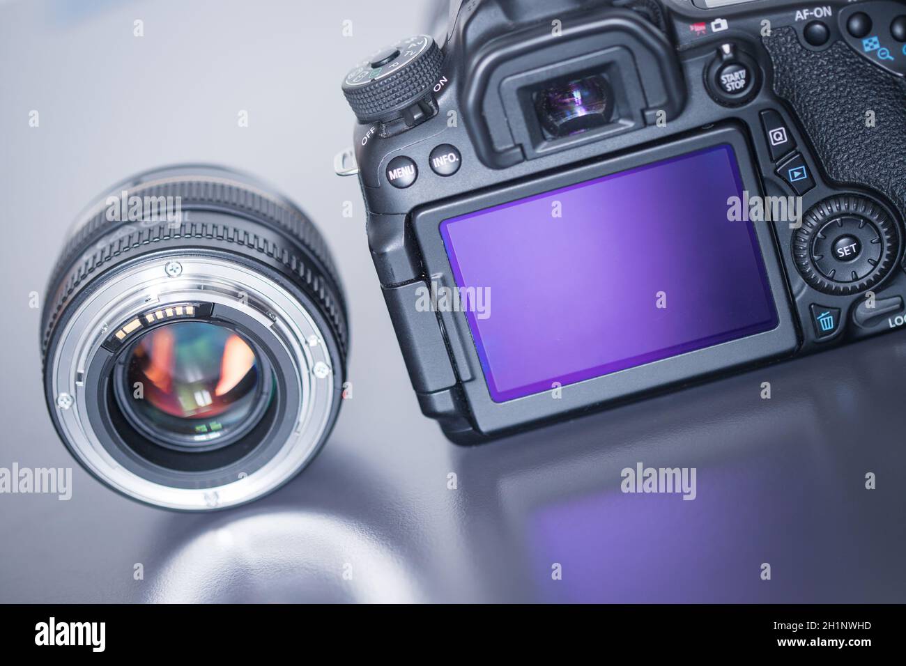 Back view of a professional reflex camera with flip lsd screen and a ...