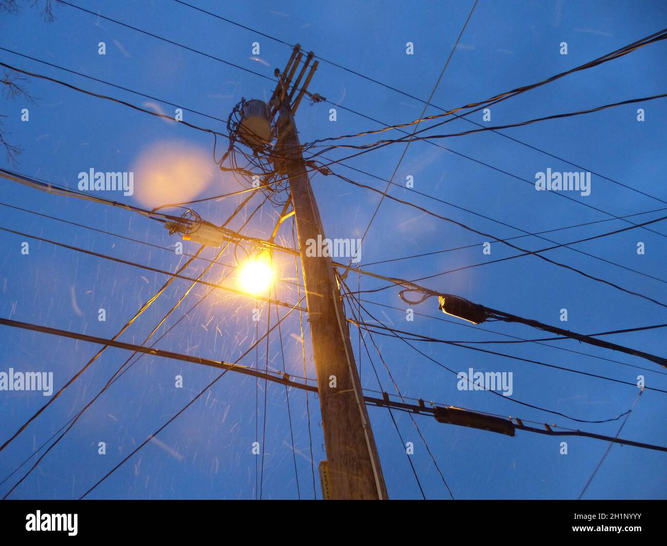 Wooden electric post with overhead wires Stock Photo - Alamy