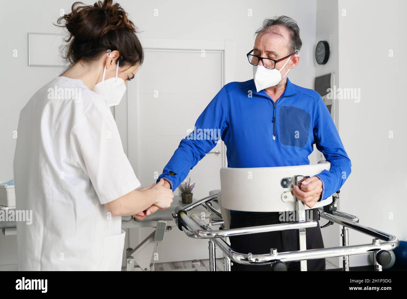 female nurse caregiver, holding patient hand, support disabled patient ...
