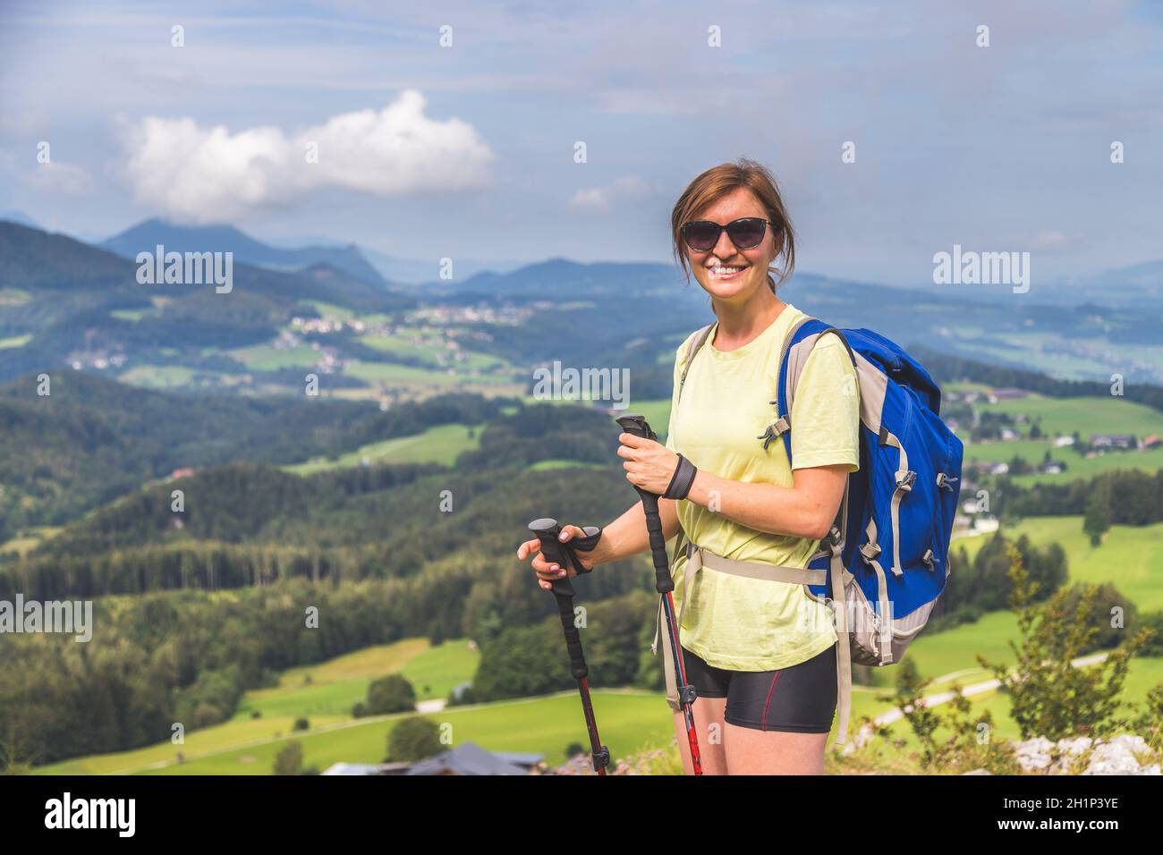 Young slim backpacker tourist girl is enjoying the view on rocky ...