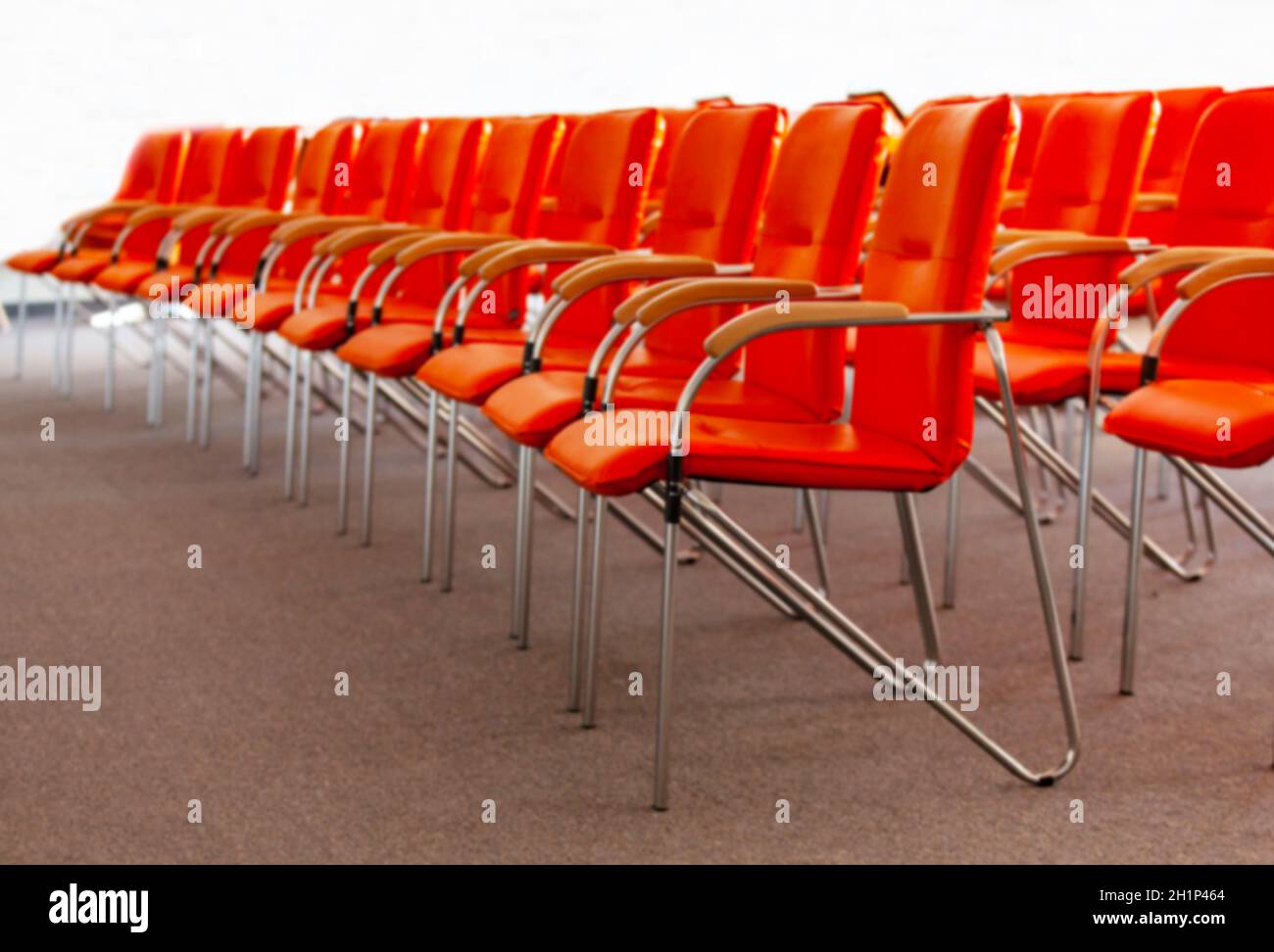 The Blurry background image of row red office chairs Stock Photo - Alamy
